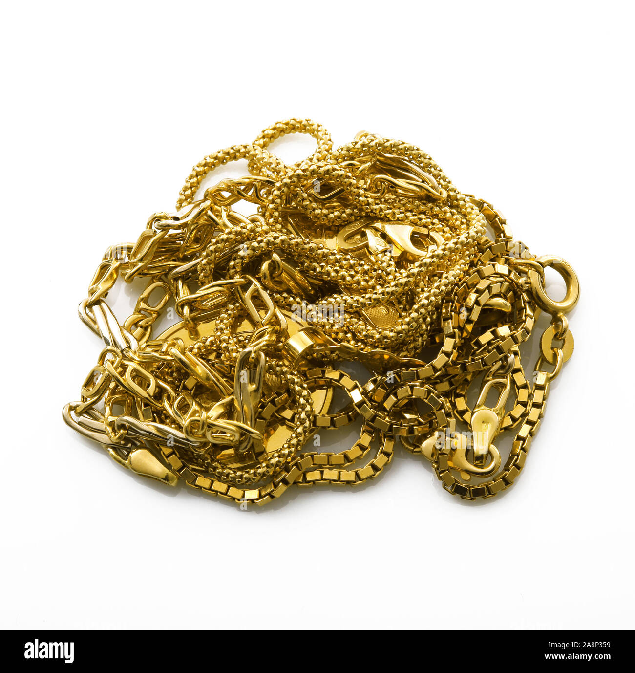 precious gold objects on white background Stock Photo - Alamy