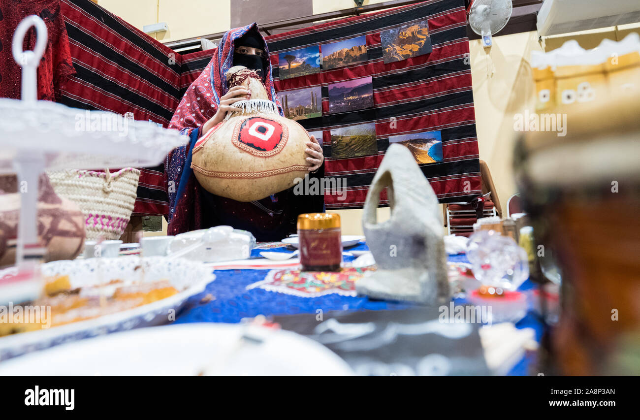 Yemeni women traditional dress cloth surrounded by some souvenirs and ...
