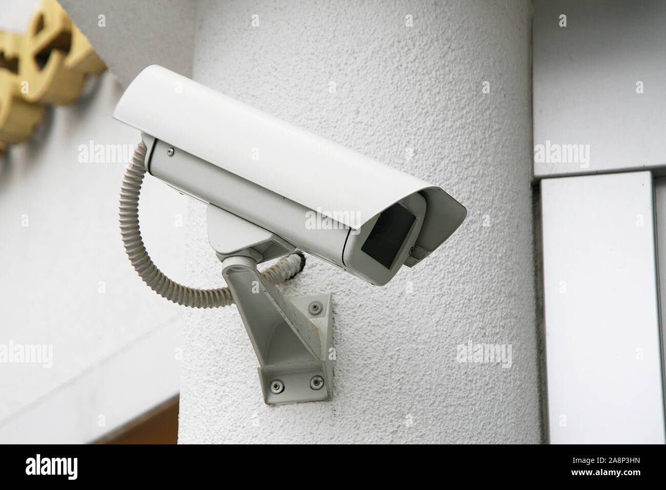 control camera on wall background Stock Photo - Alamy