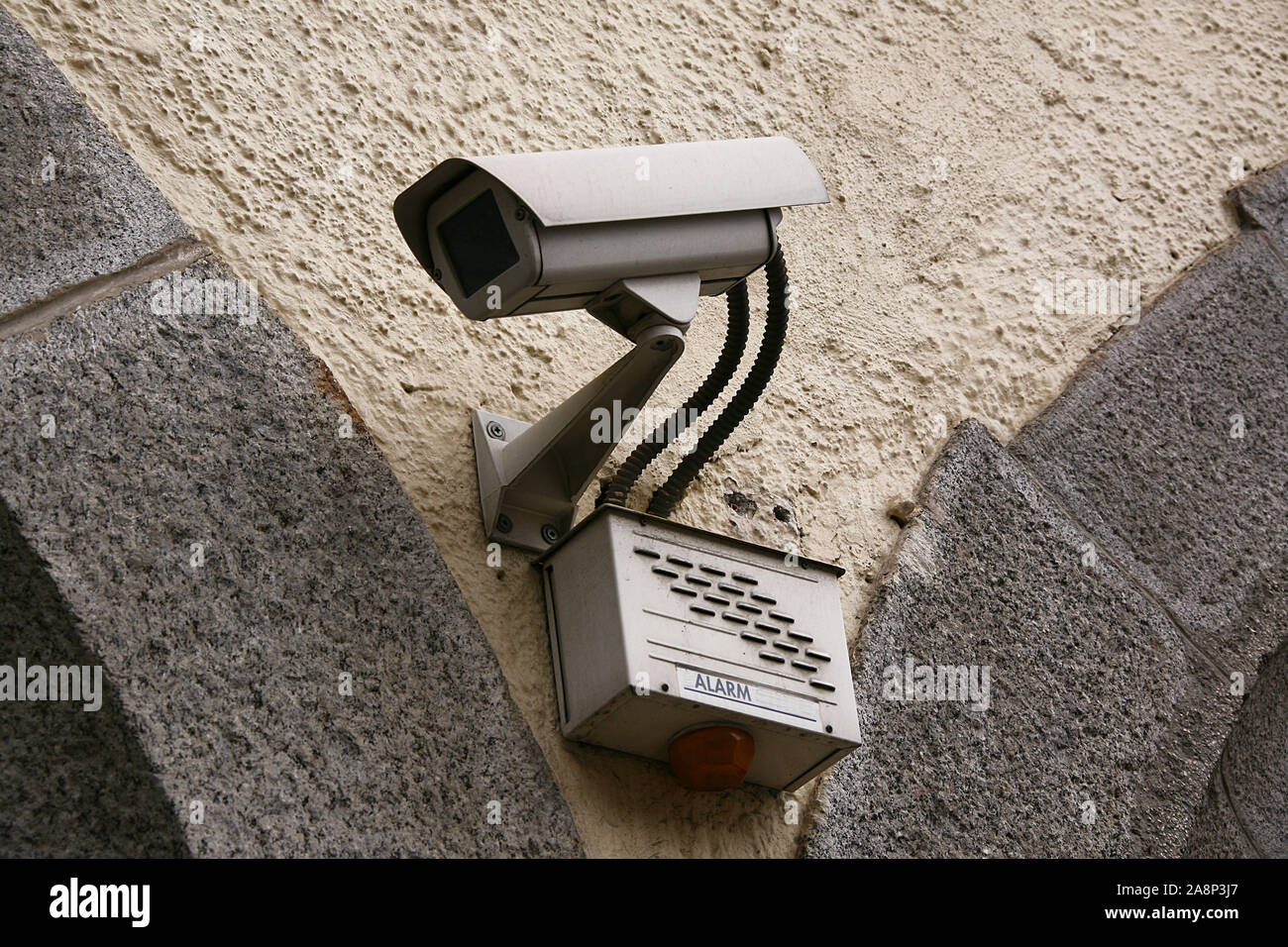 control camera on wall background Stock Photo - Alamy