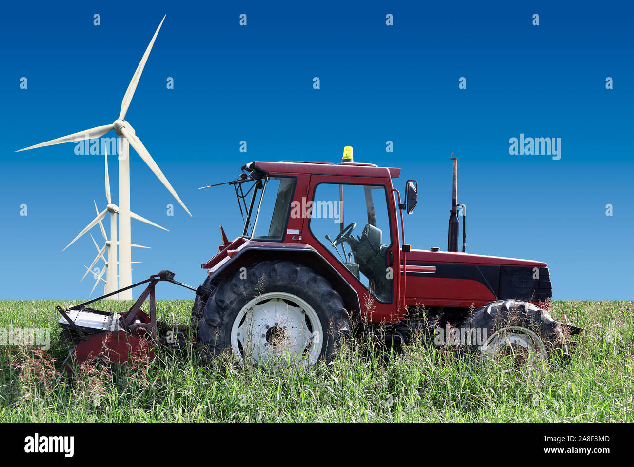 tractor at work in agricultural field with wind turbine Stock Photo - Alamy