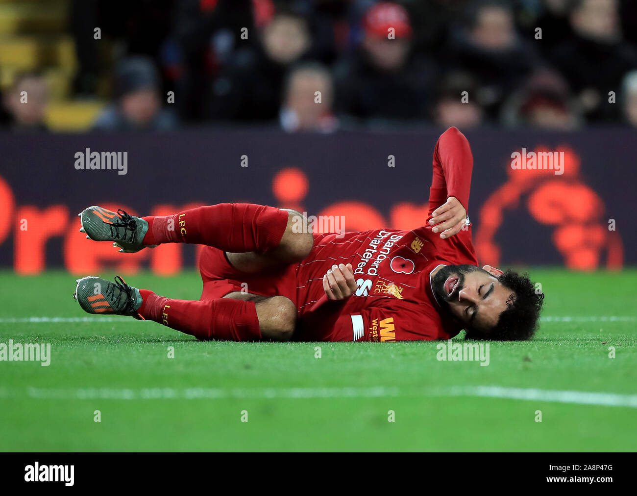 Liverpool's Mohamed Salah appears injured during the Premier League ...