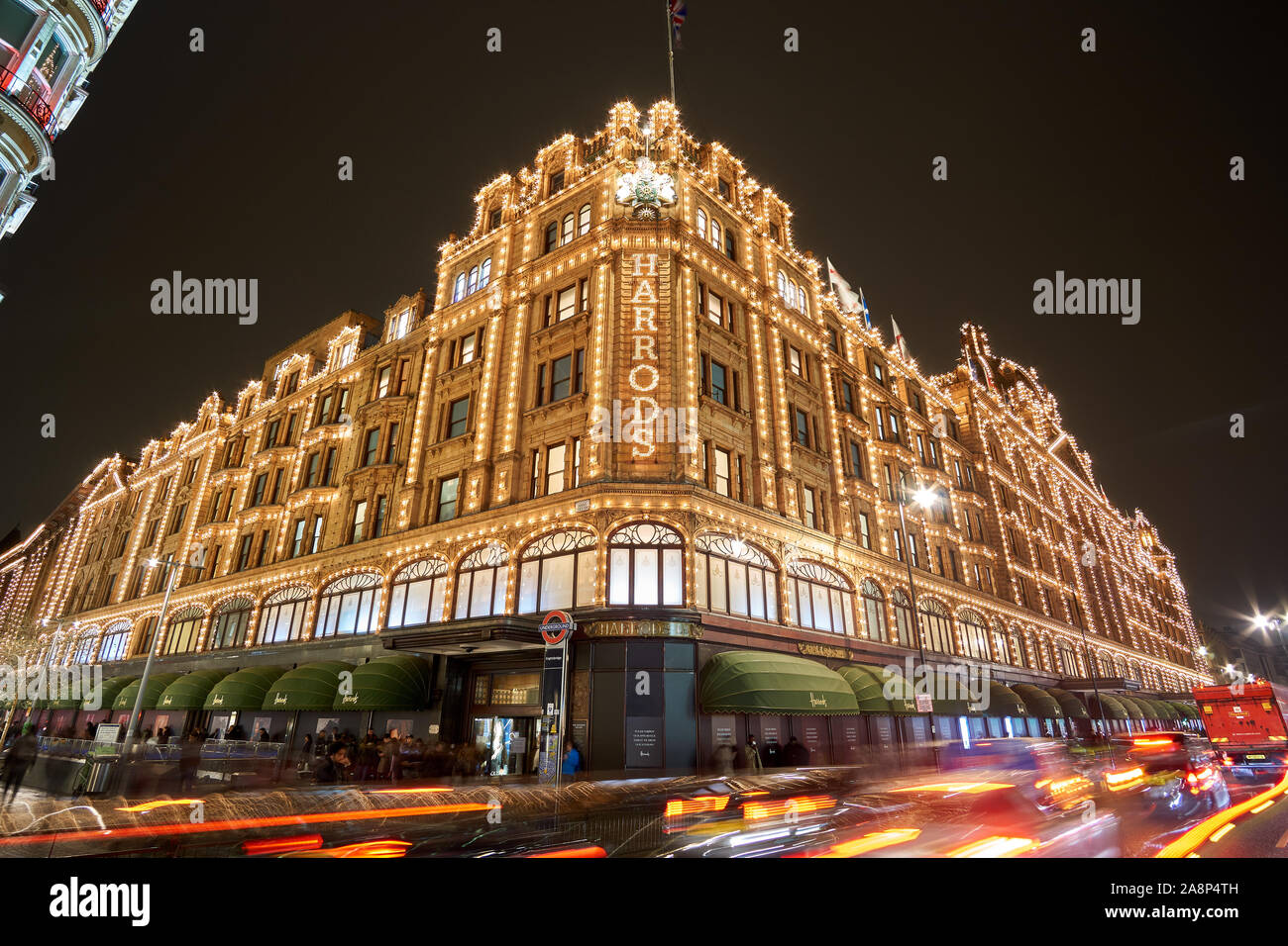 Exterior view of Harrods Department Store in London at night during ...