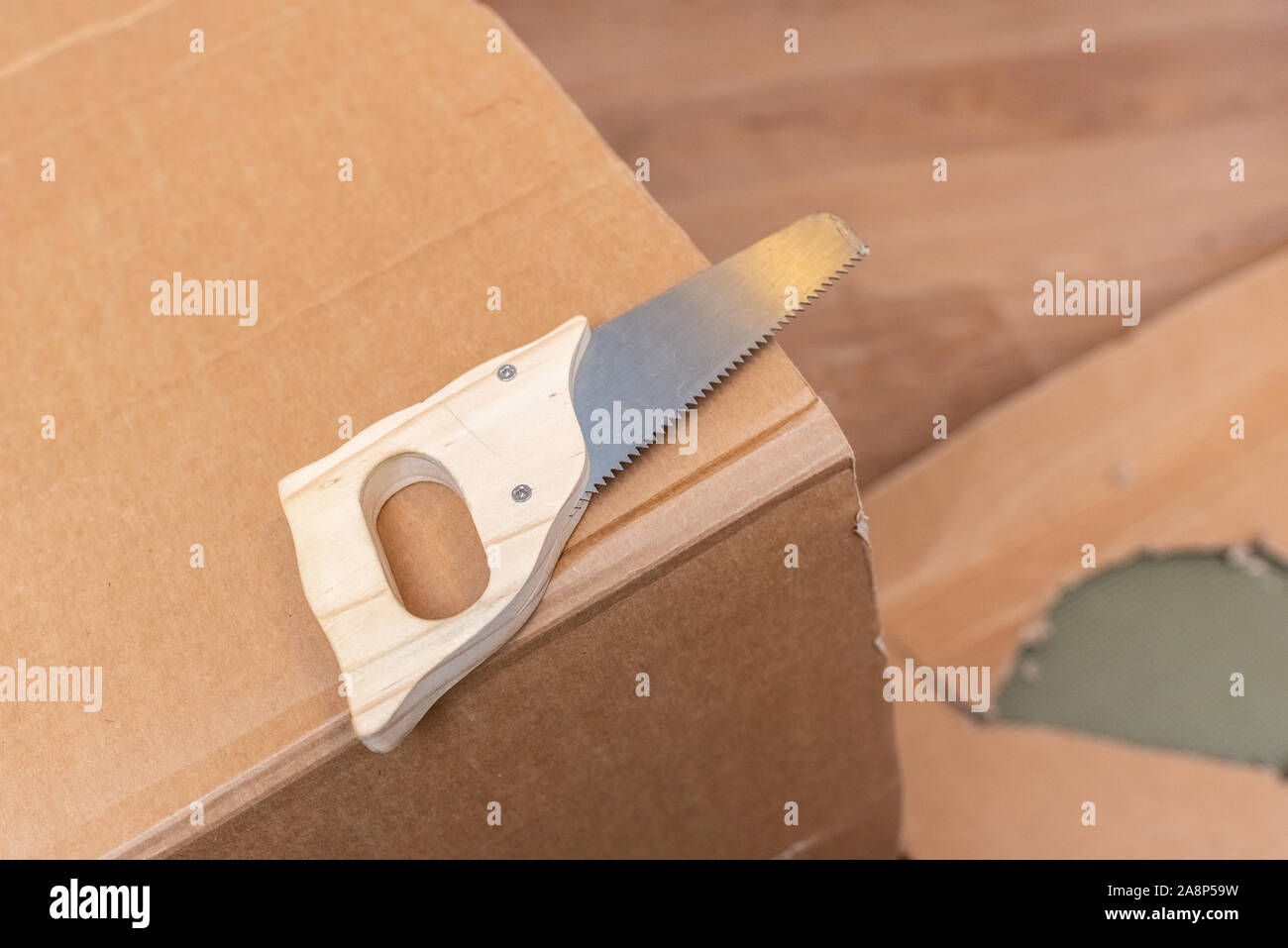 Real carpenter saw for children Stock Photo - Alamy
