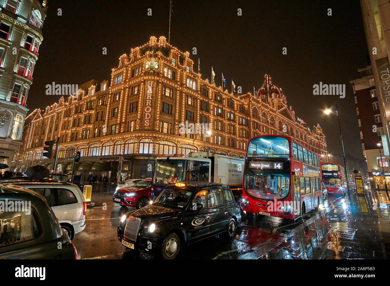 Exterior view of Harrods Department Store in London at night during ...