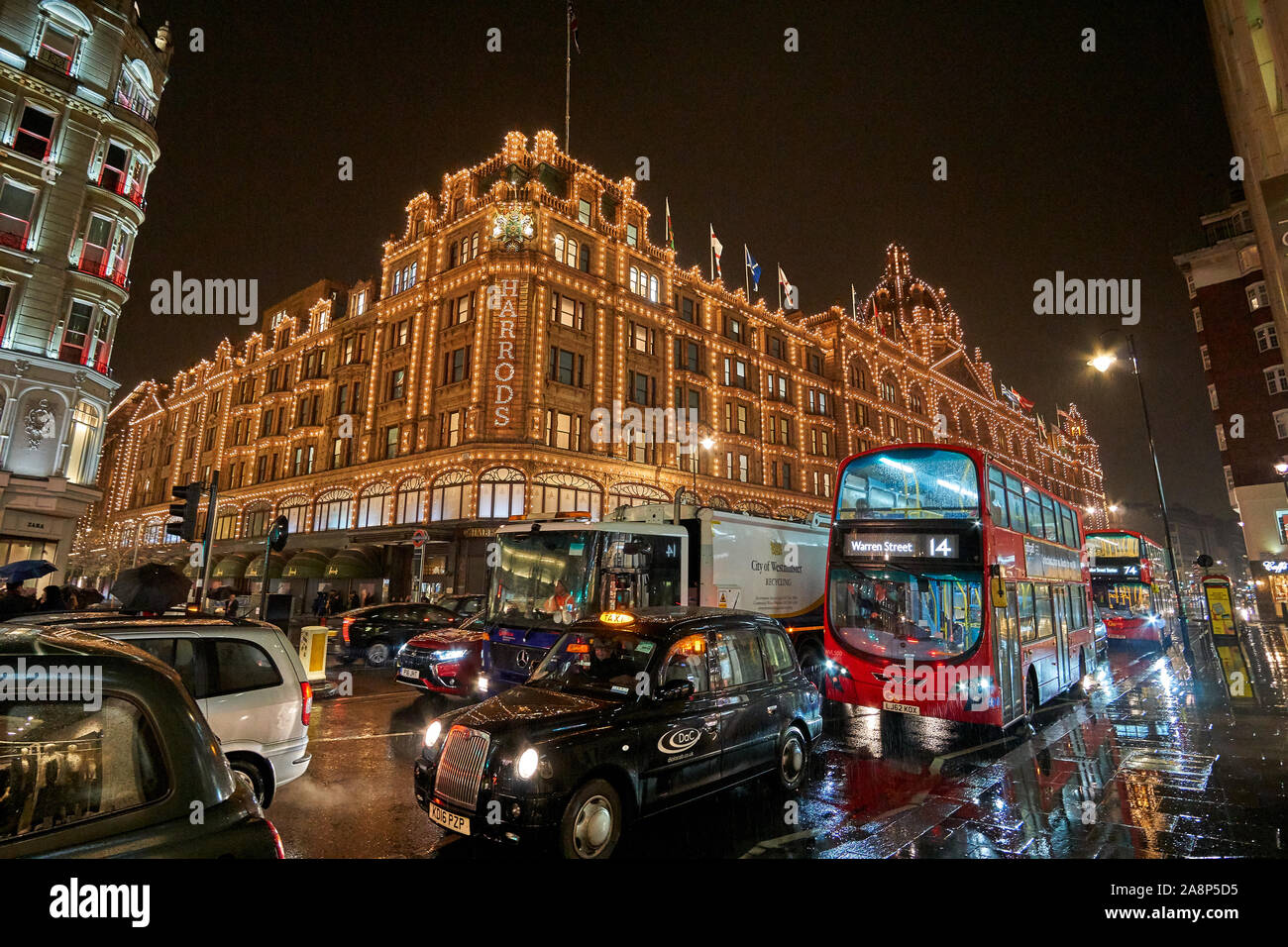 Exterior view of Harrods Department Store in London at night during ...
