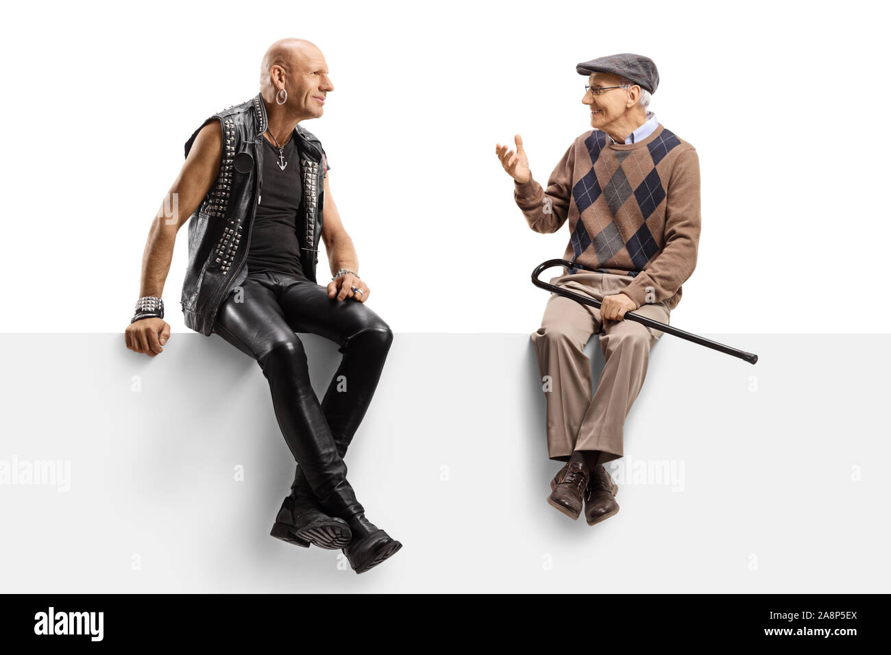Full length shot of a punk and a senior man sitting on a panel and ...