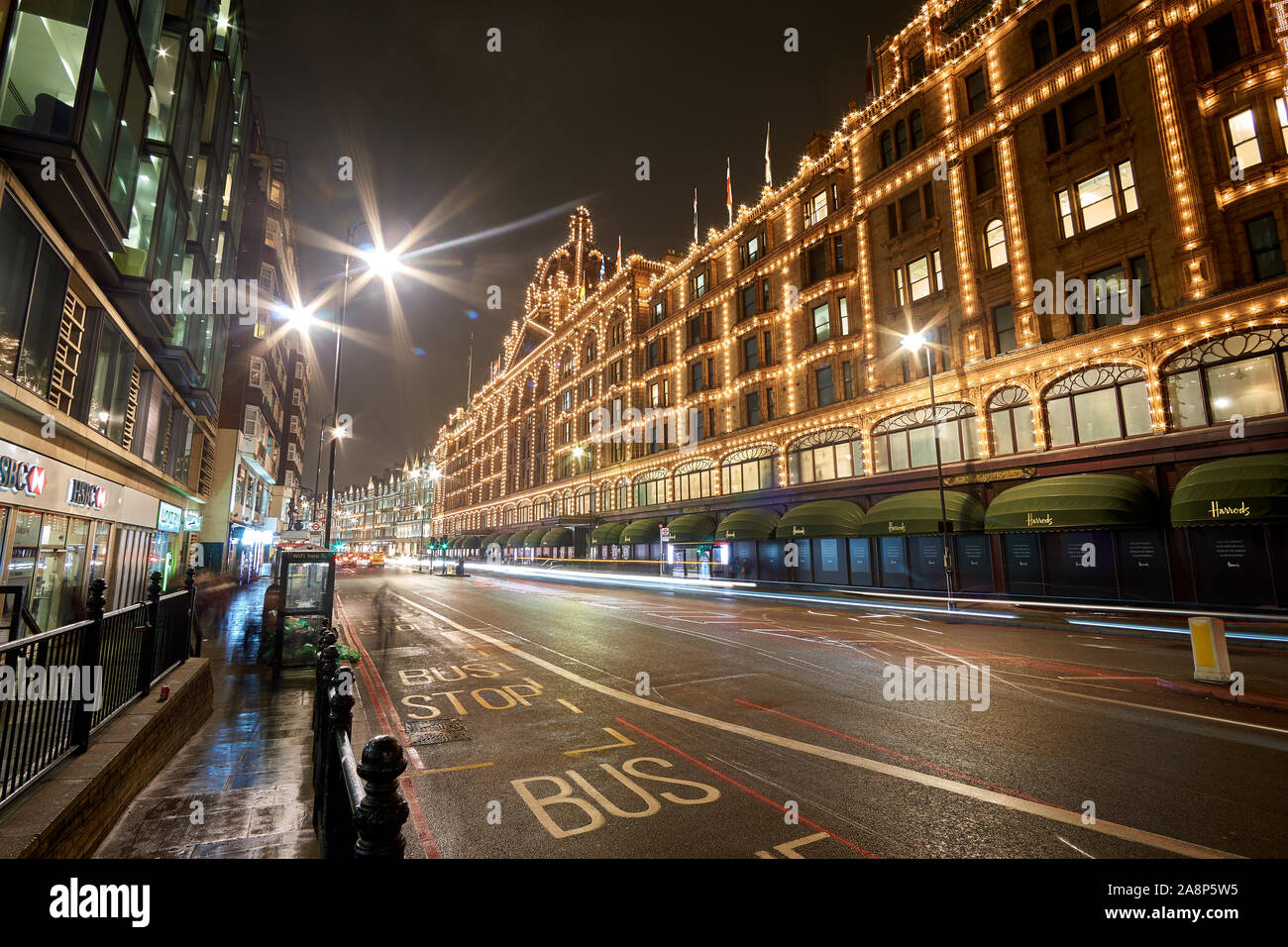 Exterior view of Harrods Department Store in London at night during ...