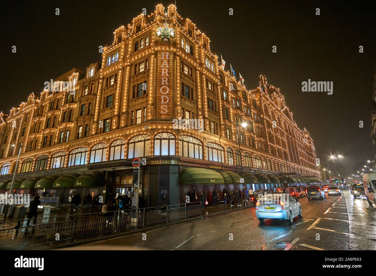 Exterior view of Harrods Department Store in London at night during ...