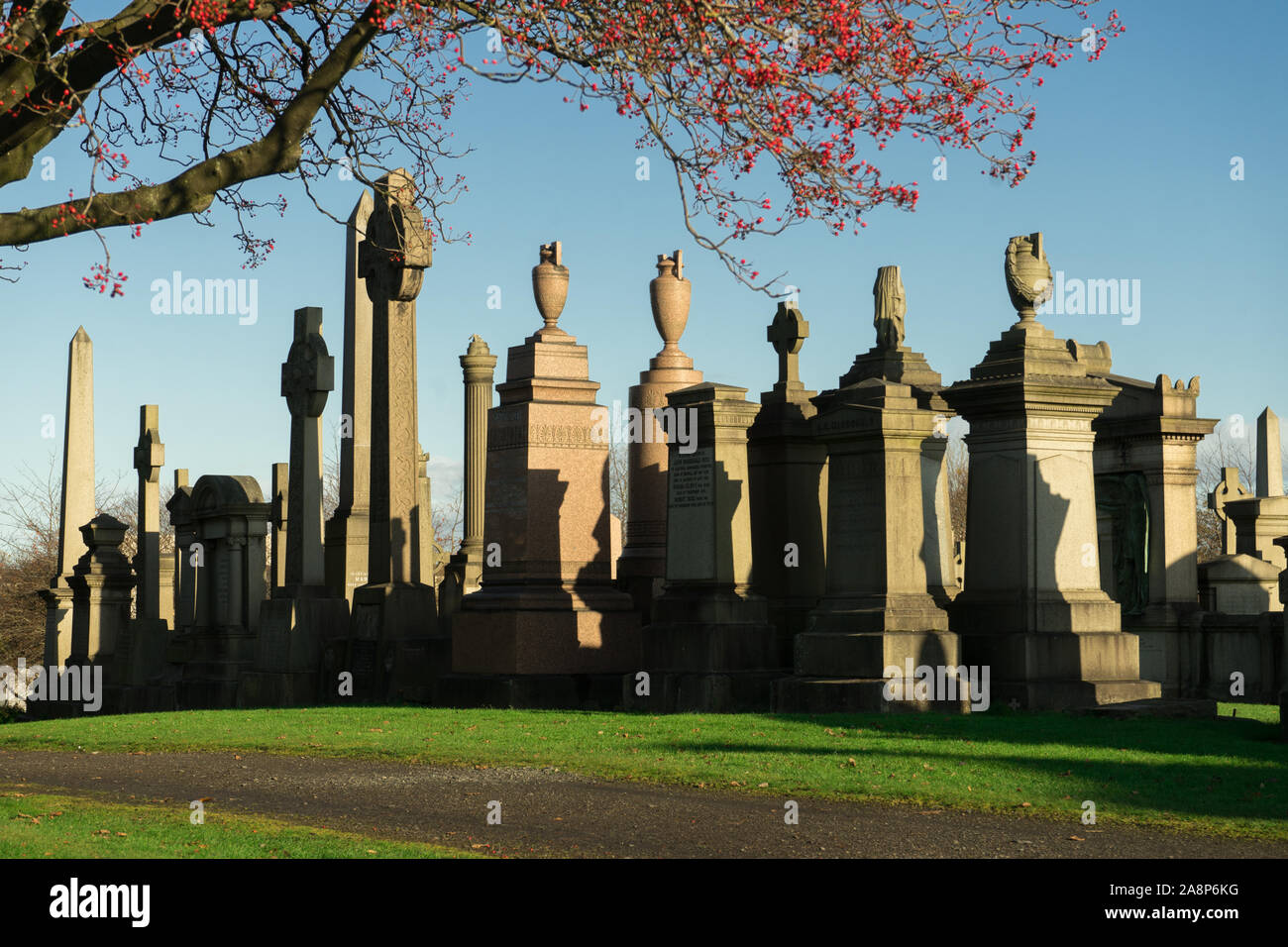 The sunny autumn day of the old Victorian cemetery Necropolis. Religion ...