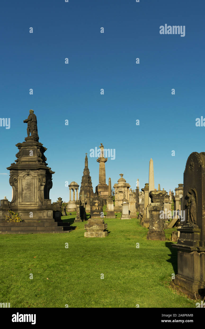 The sunny autumn day of the old Victorian cemetery Necropolis. Religion ...