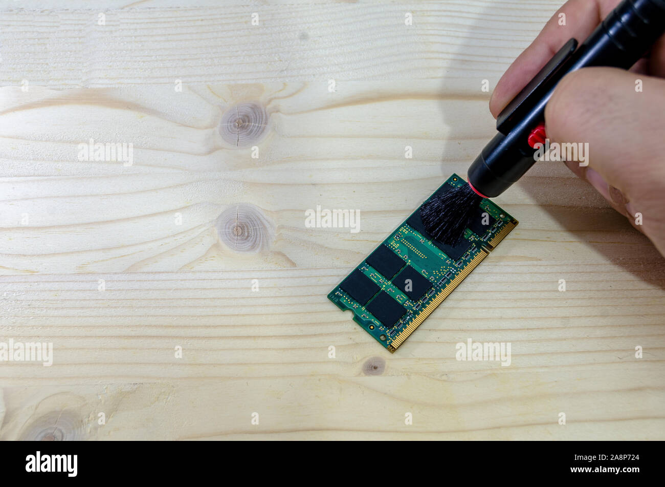 brush cleaning electronic board Stock Photo - Alamy