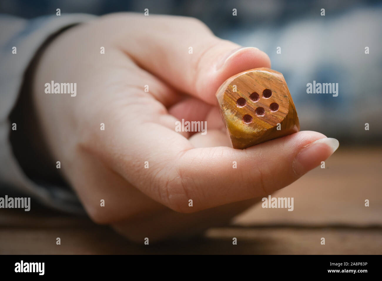 The dice in female hand close up Stock Photo - Alamy
