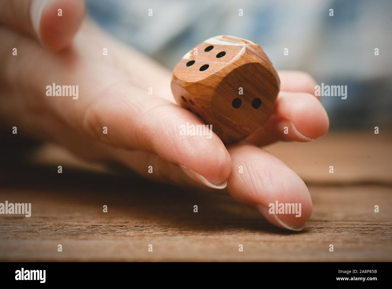Hand throwing dice woman hi-res stock photography and images - Alamy