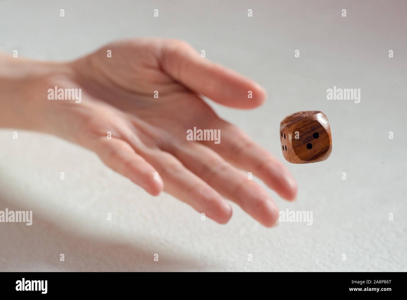 Hand throwing dice woman hi-res stock photography and images - Alamy
