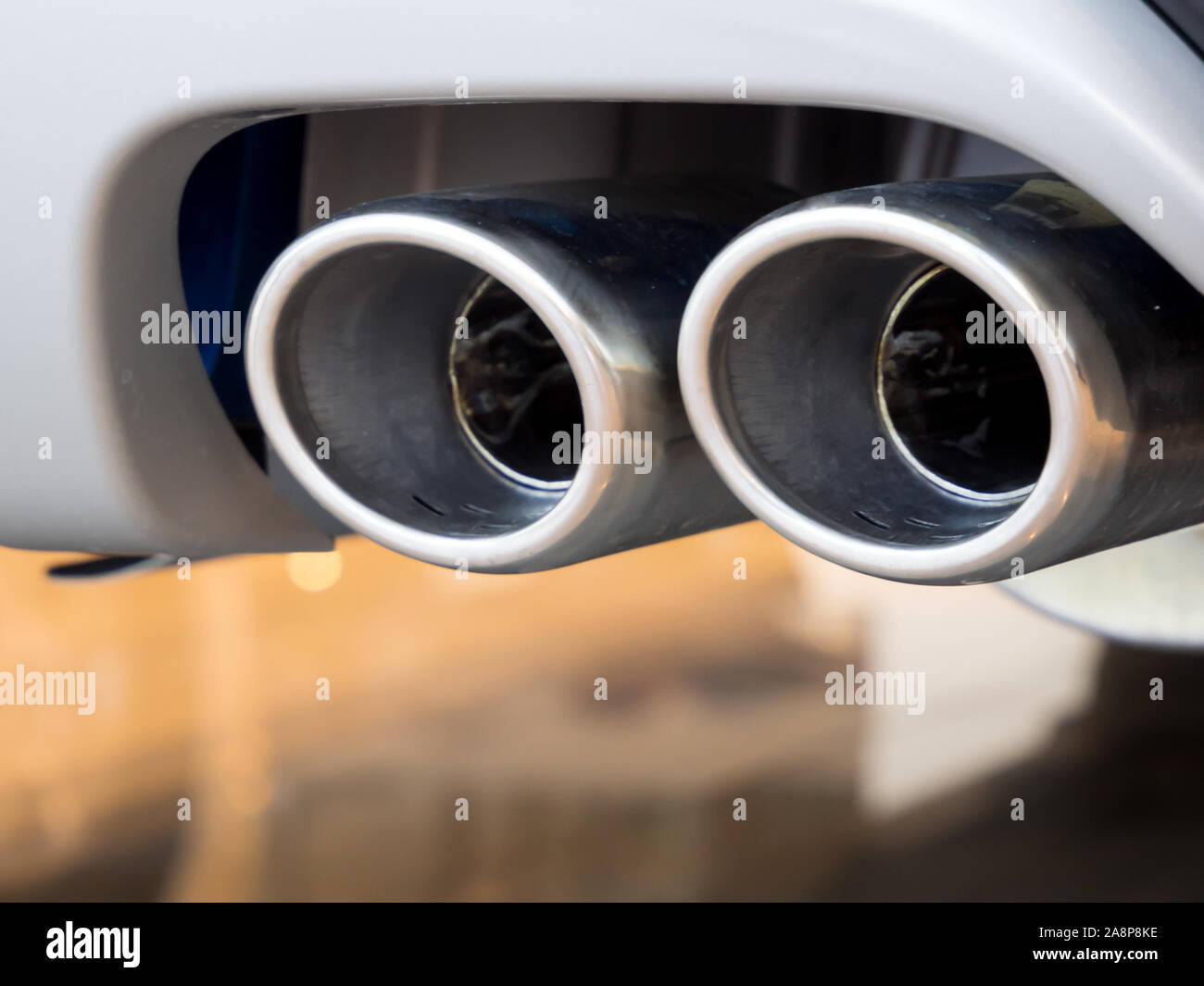 Double exhaust design solution in a conventional car Stock Photo - Alamy