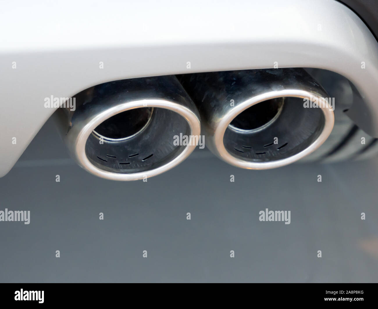 Double exhaust pipe of a car exhaust system Stock Photo - Alamy