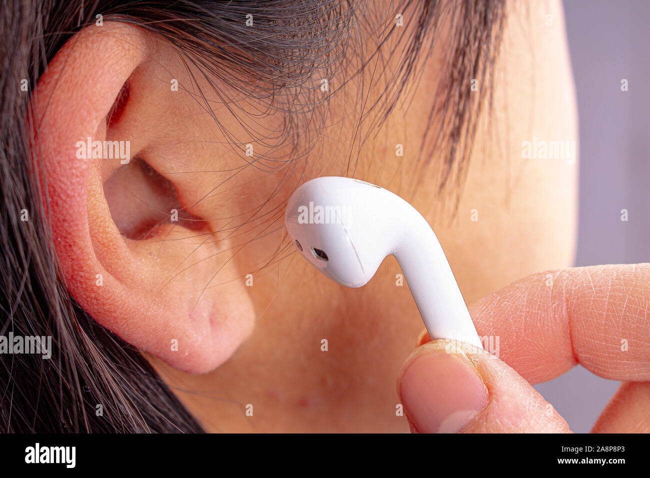 Female about to wear earphones headphones Stock Photo - Alamy