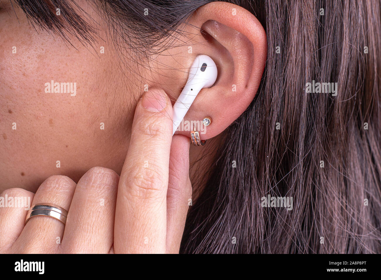 Mature woman wearing earphones headphones Stock Photo - Alamy