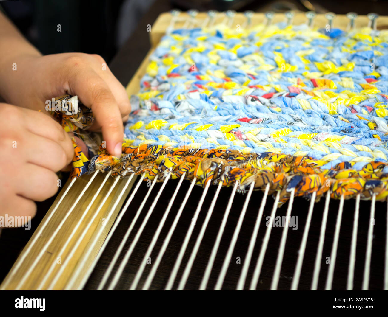 The process of weaving a traditional Russian patchwork rug Stock Photo ...