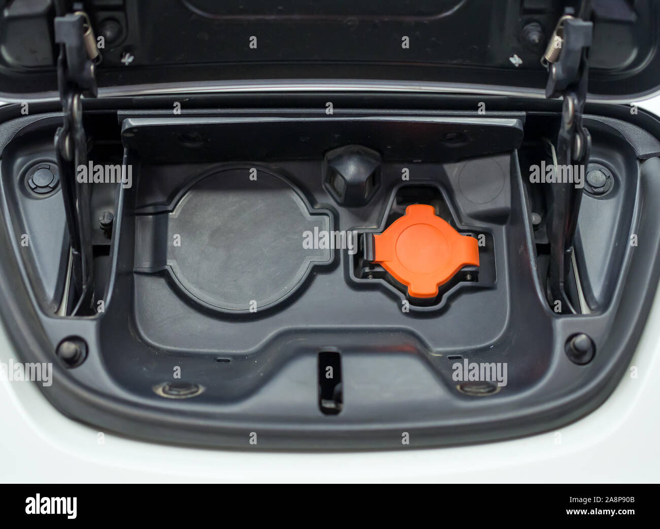 Electric vehicle charging socket by protective cover Stock Photo - Alamy