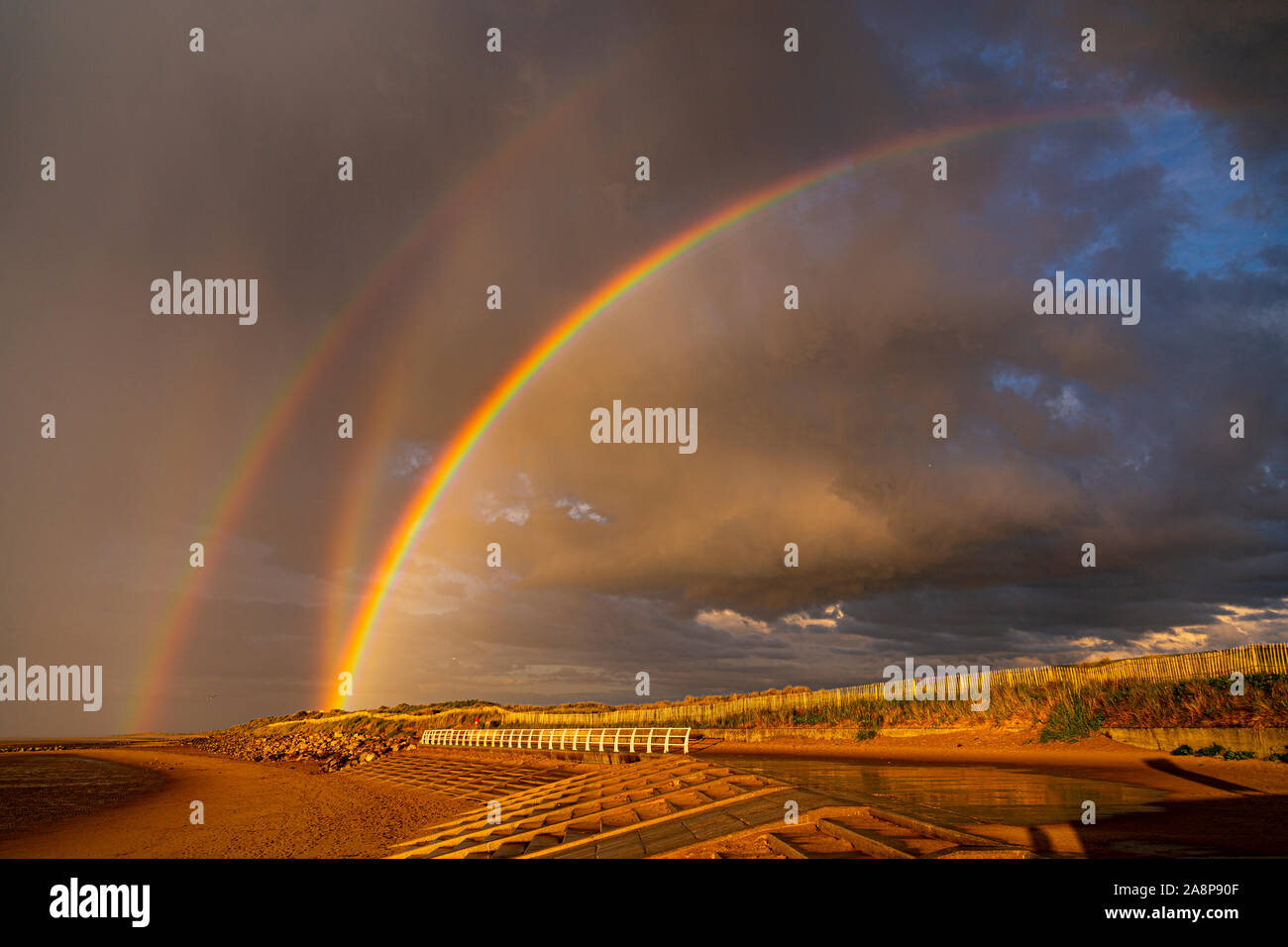 Vivid double rainbow over the beach at Prestatyn on the North Wales ...