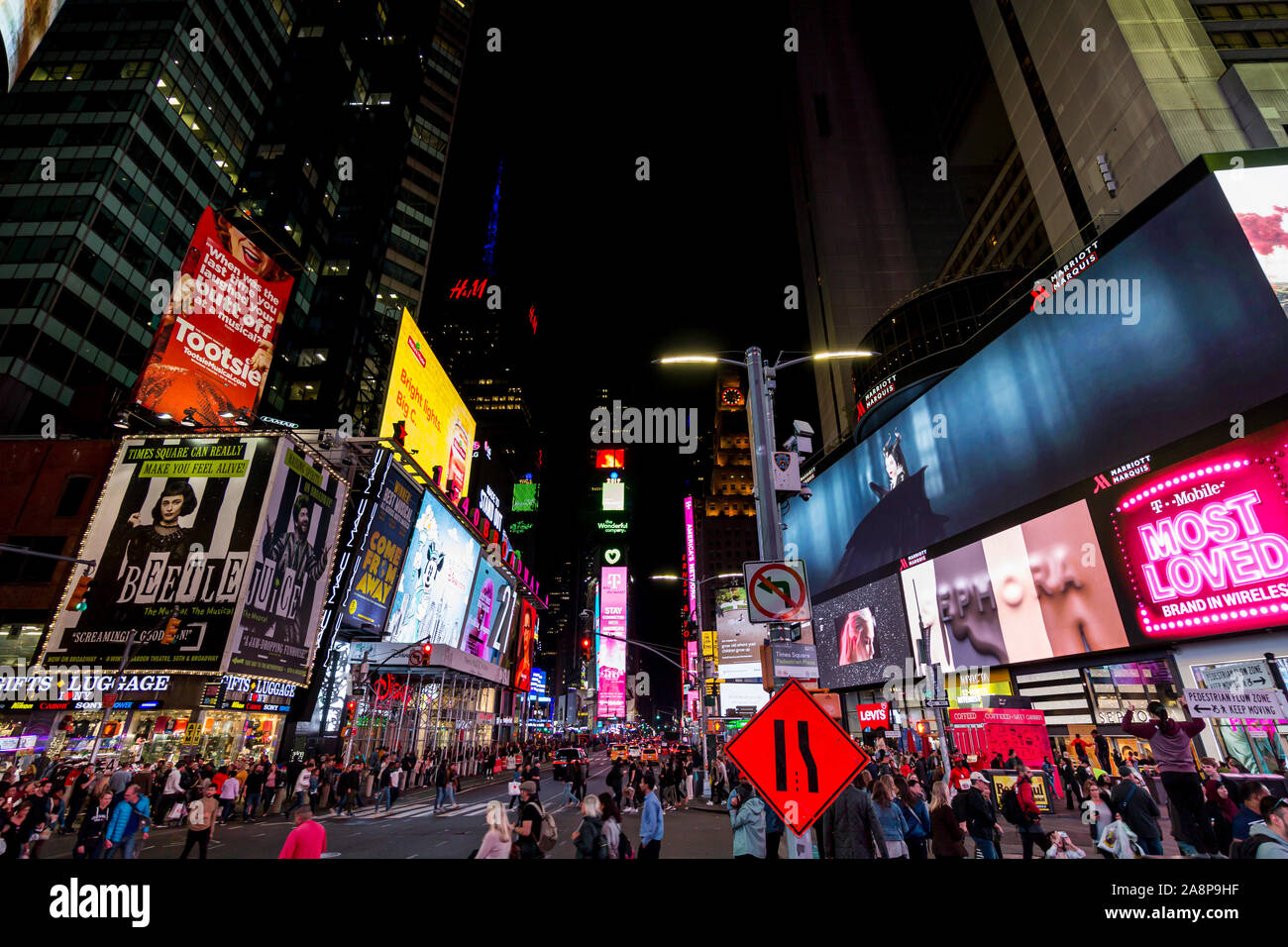 Times Square, a busy and crowded intersection in Manhattan, with many ...