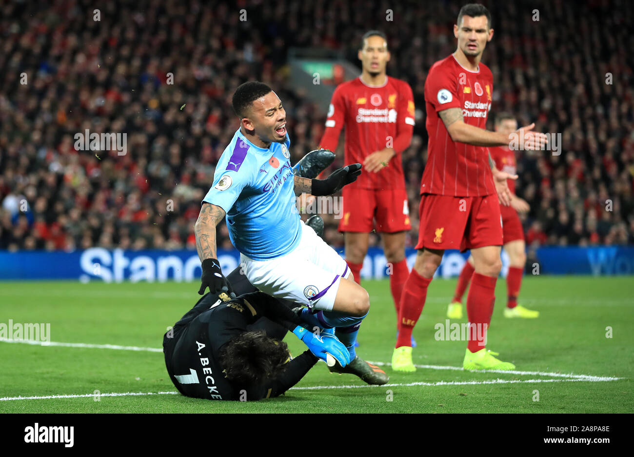 Manchester City's Gabriel Jesus collides with Liverpool goalkeeper ...