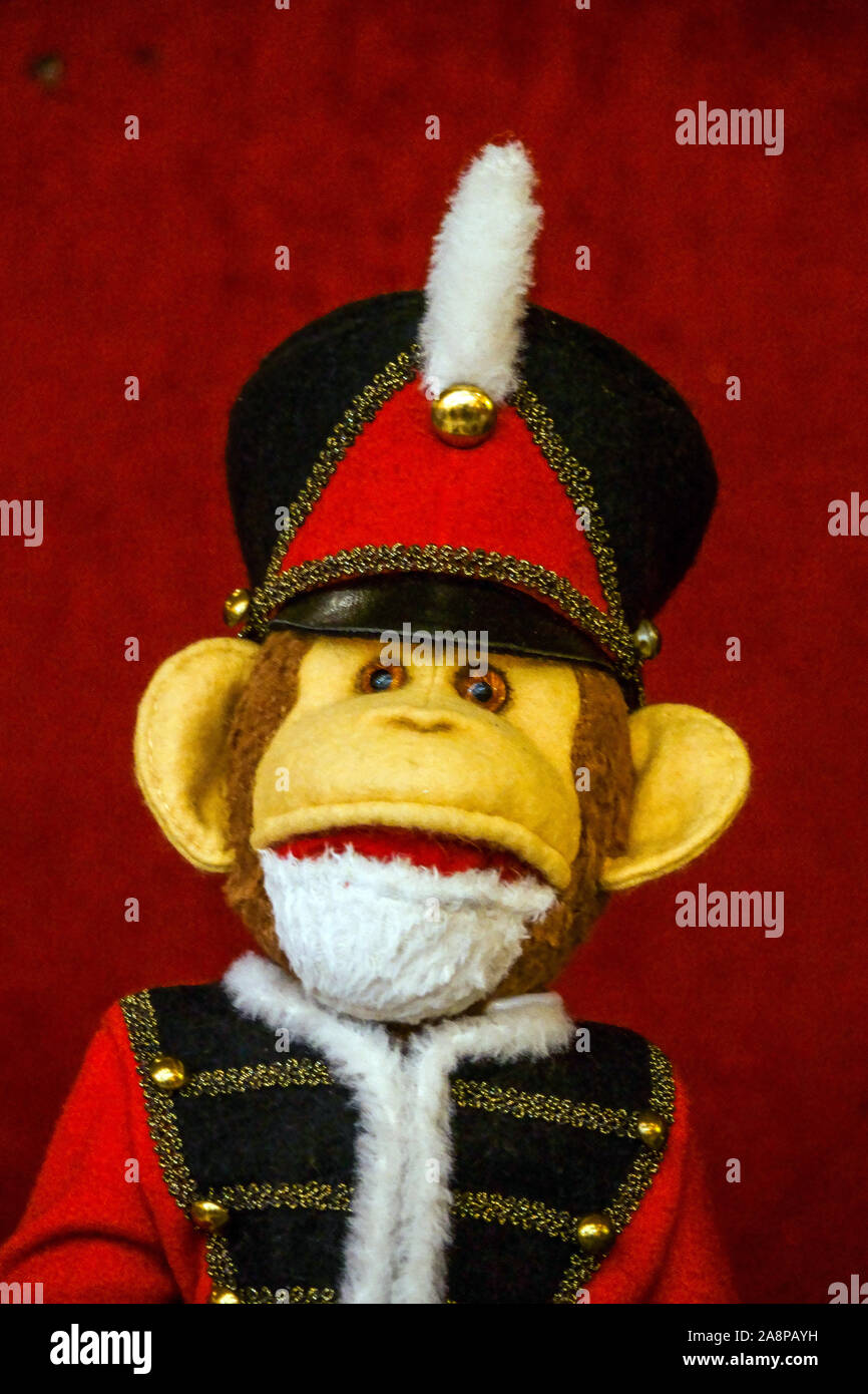 Old monkey toy in uniform Stock Photo - Alamy