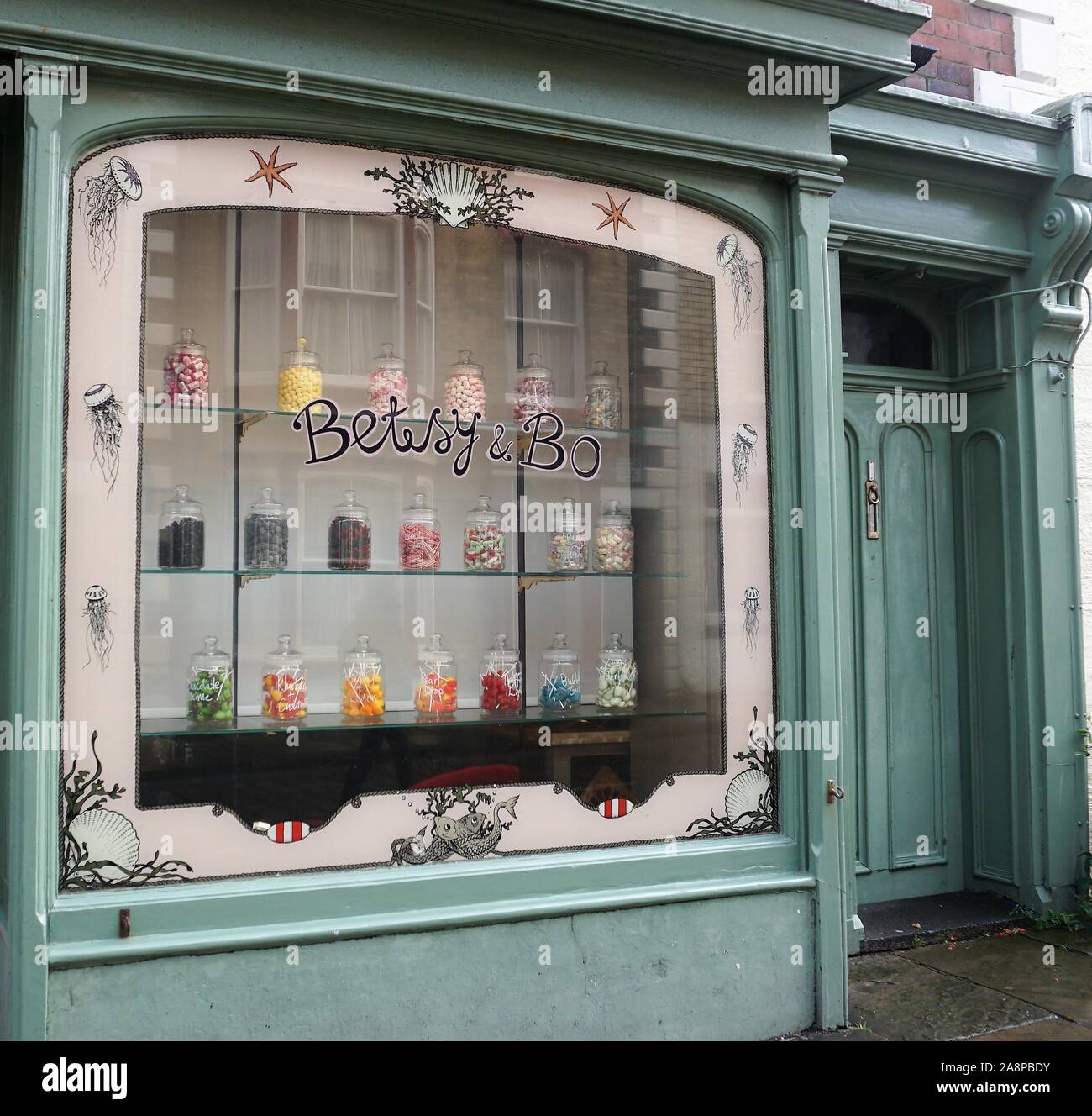 Sweets in a shop window, Staithes, North Yorkshire, UK Stock Photo - Alamy