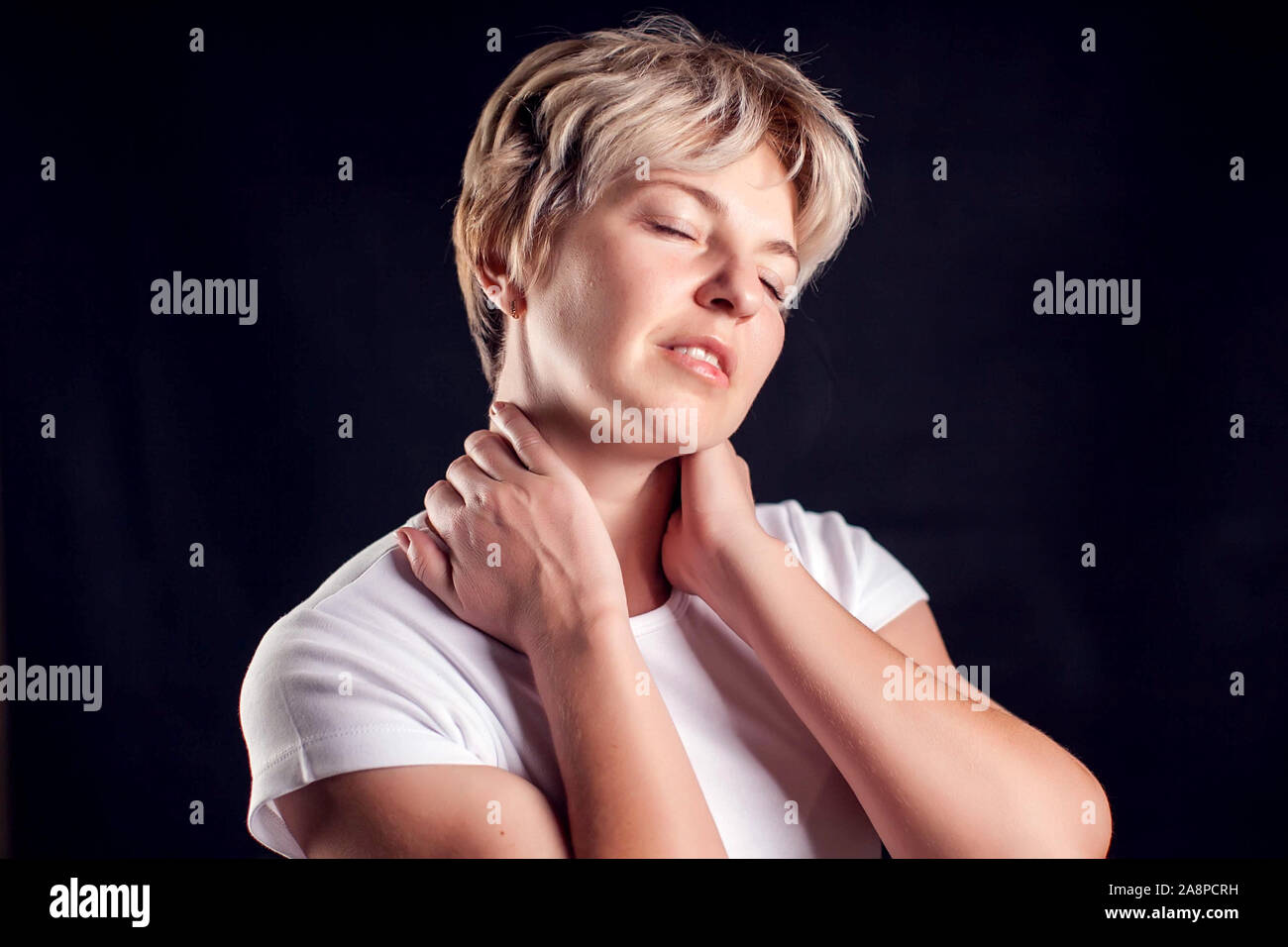 Woman feels strong neck pain. People, healthcare and medicine concept ...