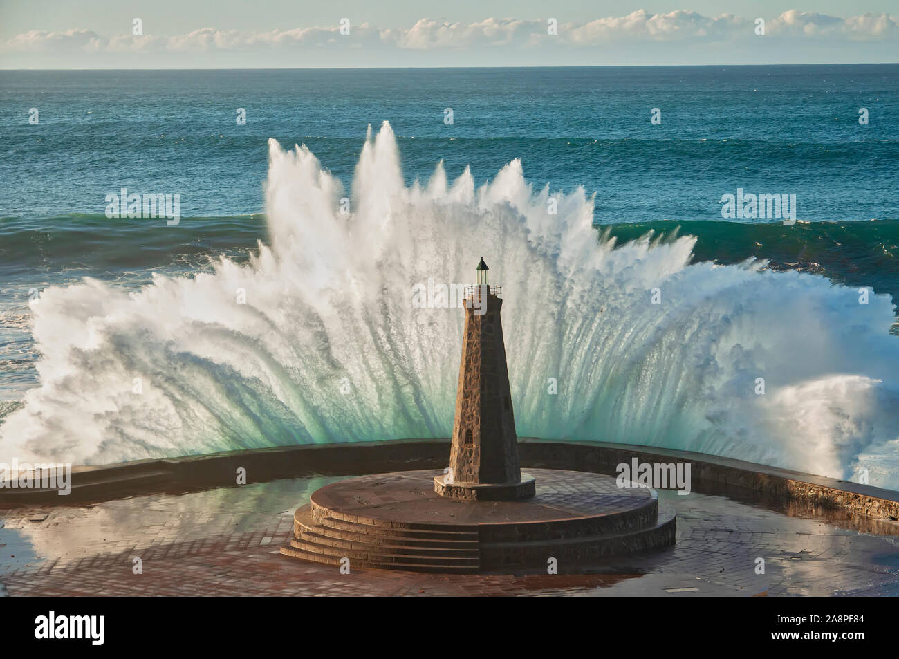 waves and lighthouse Stock Photo - Alamy