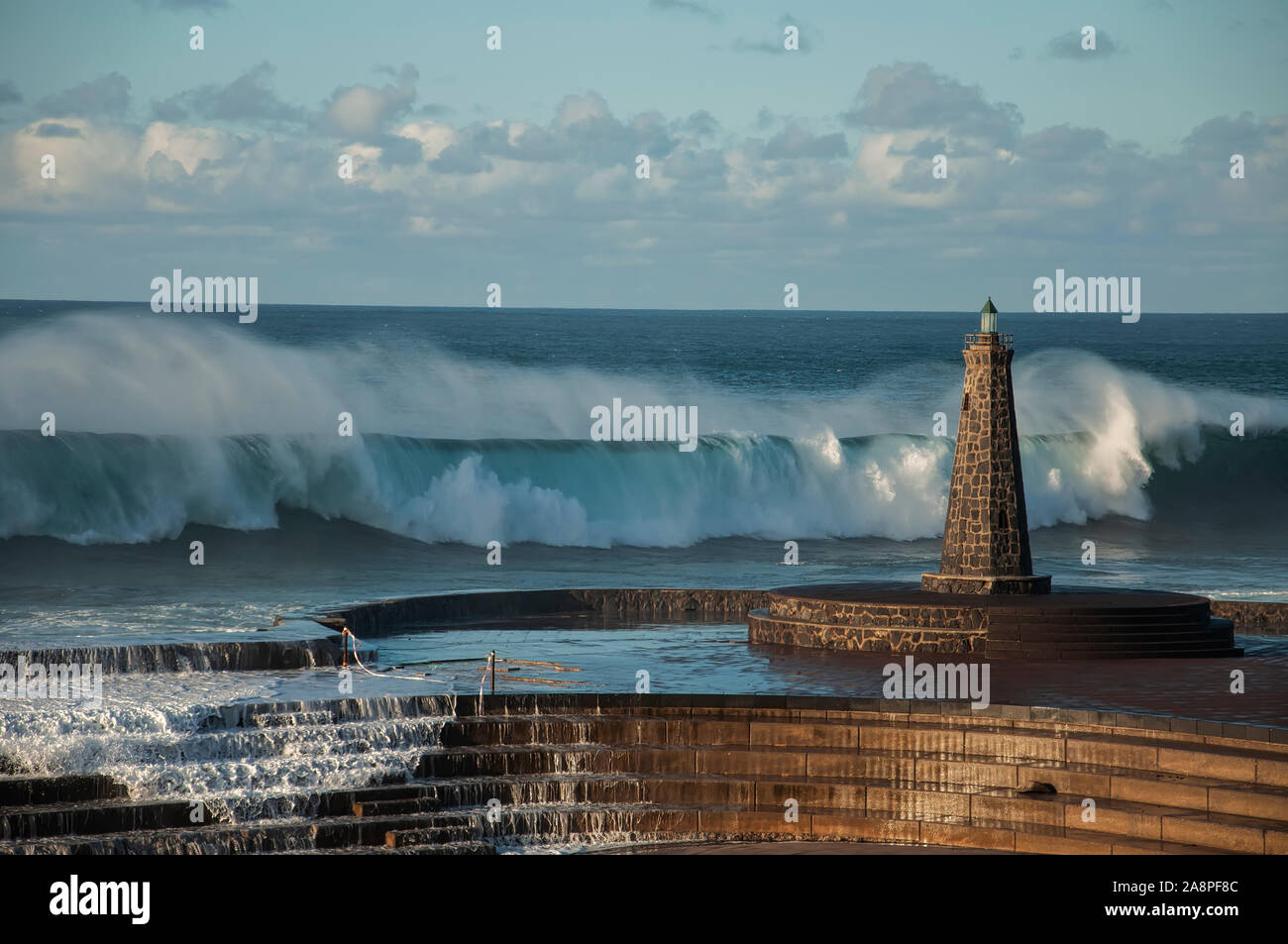 lighthouse with sea waves Stock Photo - Alamy