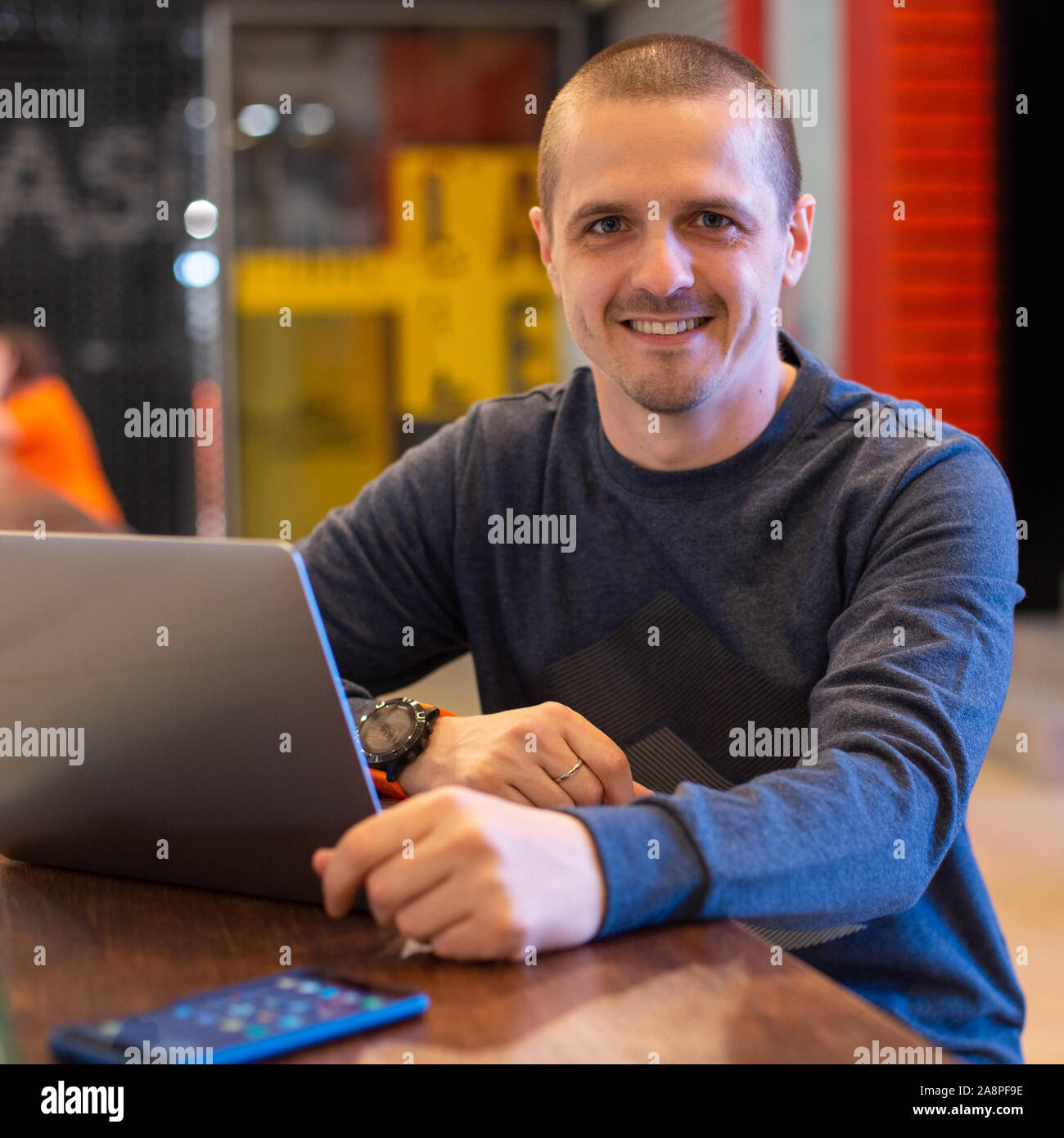 Young man looking computer monitor hi-res stock photography and images ...