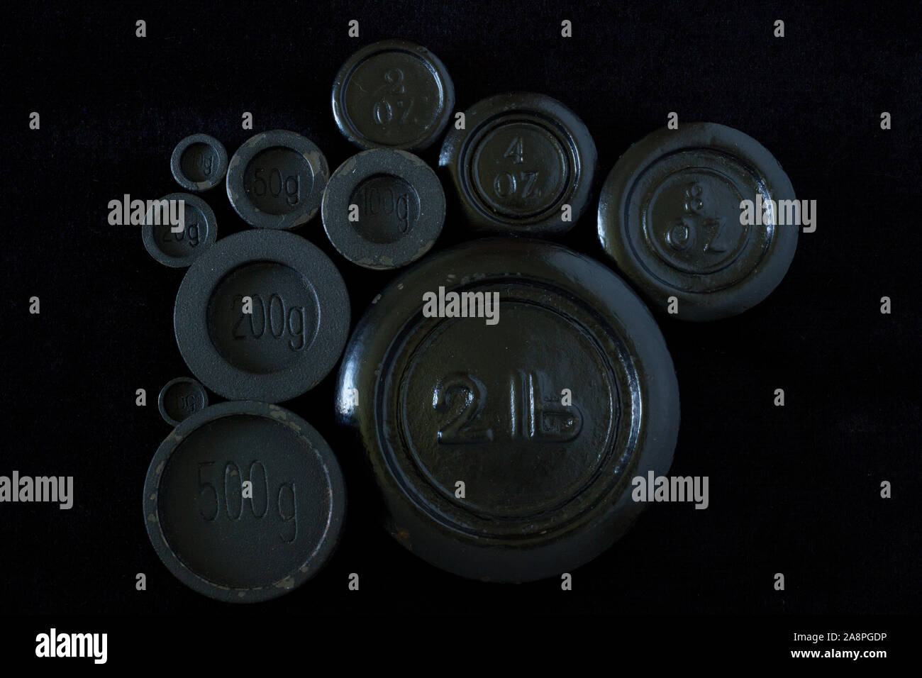 black weights scales low key Stock Photo - Alamy