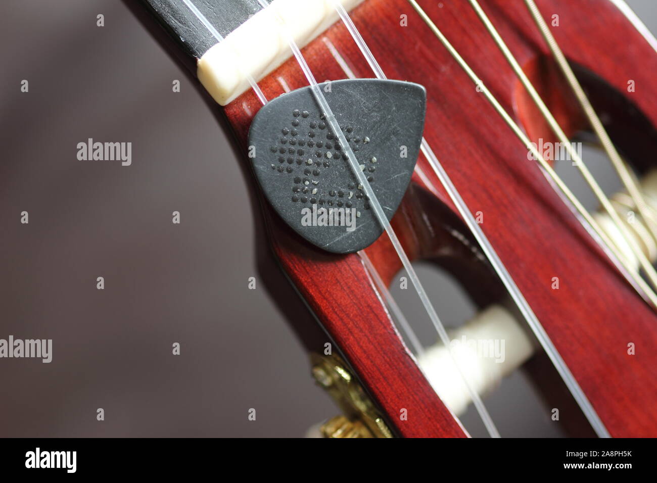 Guitar and plektrum Stock Photo - Alamy
