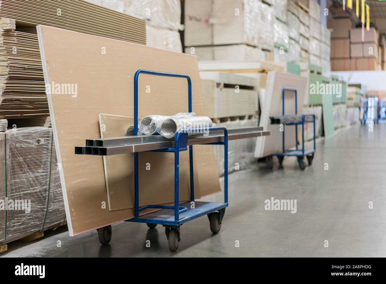 Trolley in a hardware store loaded with construction materials. Repair ...