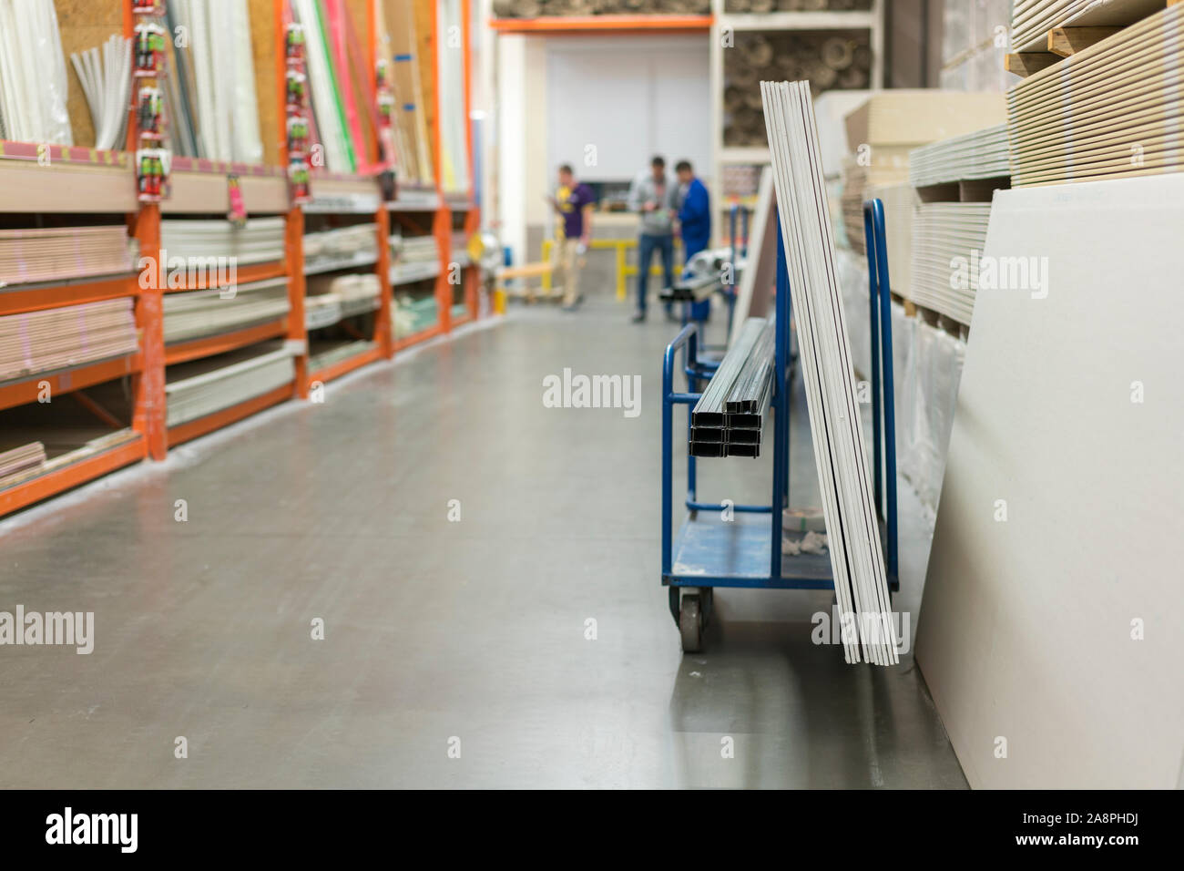 Trolley in a hardware store loaded with construction materials. Repair ...