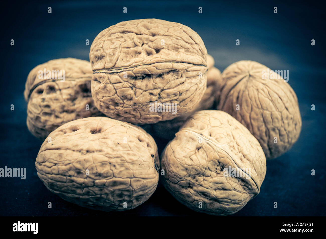 Fresh walnut going to be cracked Stock Photo - Alamy