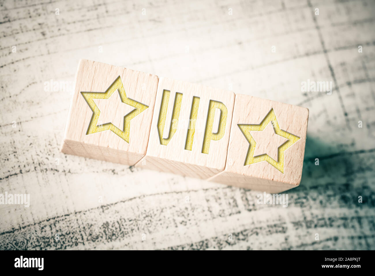 The Word VIP With Two Stars On Wooden Blocks On Table Stock Photo - Alamy