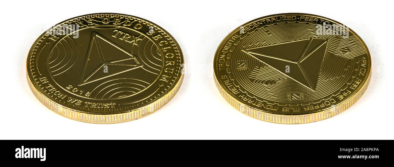Face and back side of the crypto currency golden tron isolated on white ...