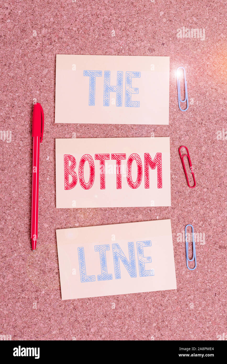 Writing note showing The Bottom Line. Business concept for asking ...