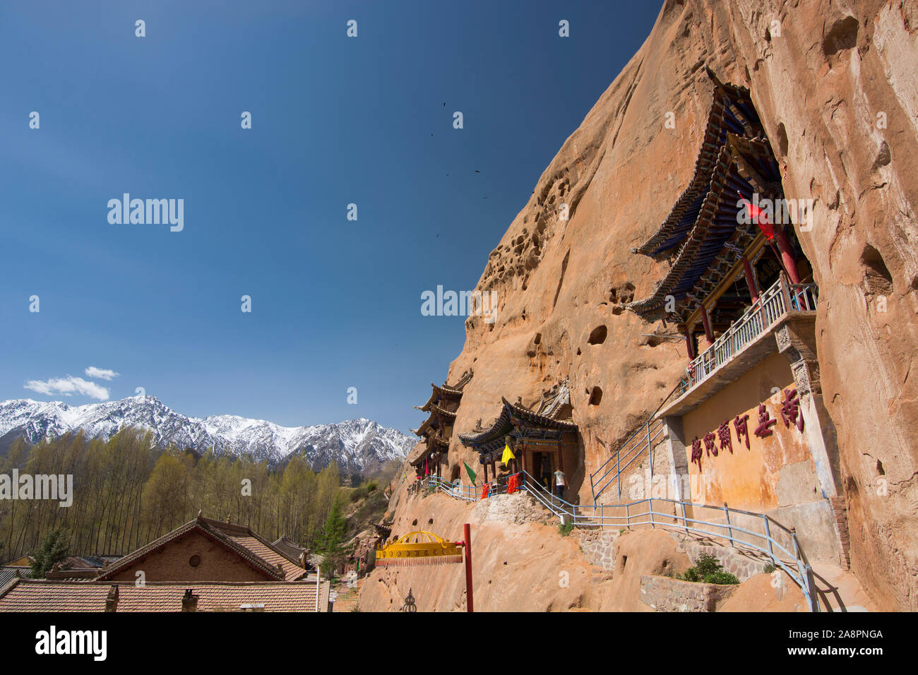 Caves carved into the cliff's face at the buddhist monastery of Mati Si ...