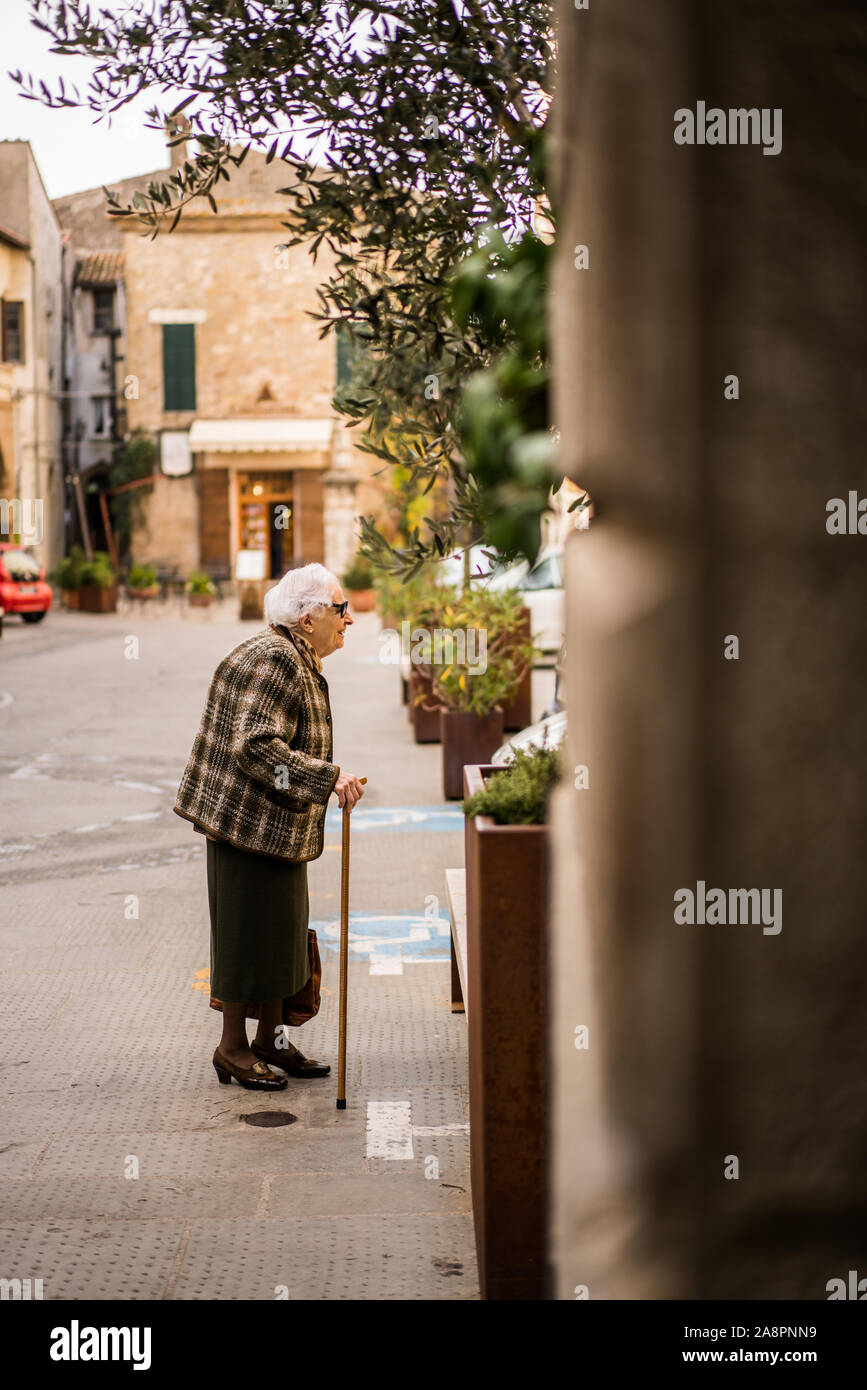 Local people in the street of the village Pitigliano, Tuscany, Italy ...
