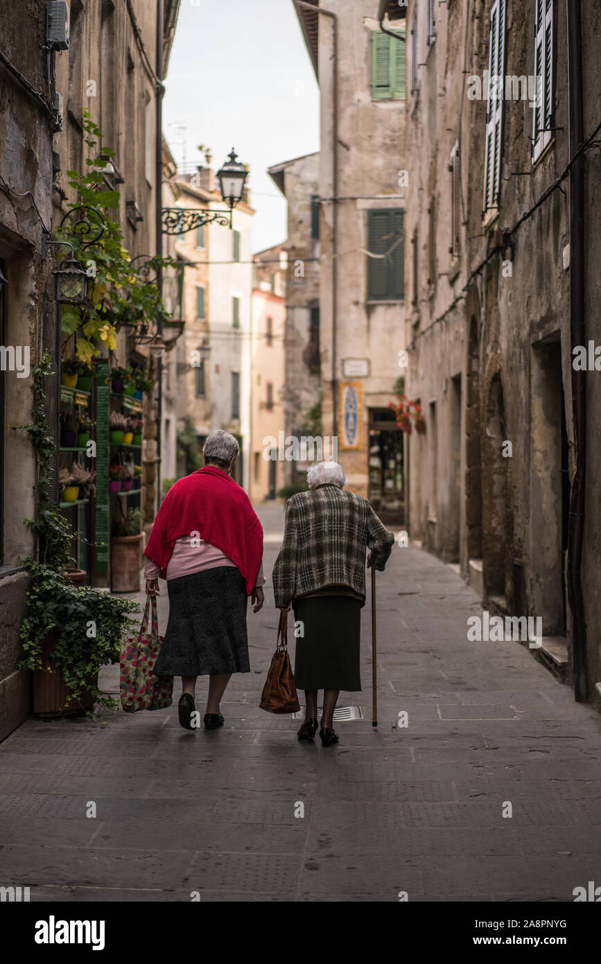 Local people in the street of the village Pitigliano, Tuscany, Italy ...