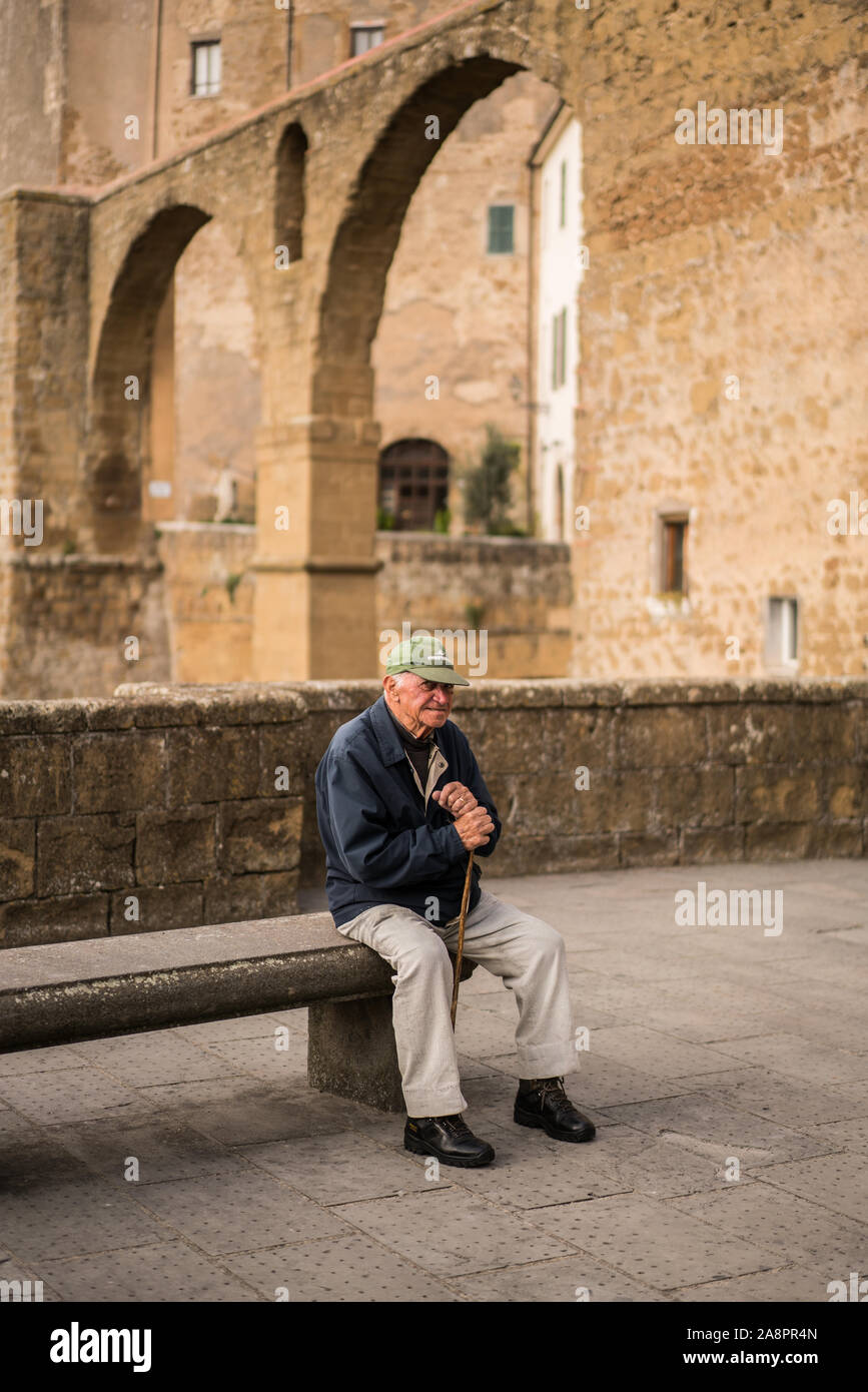 Local people in the street of the village Pitigliano, Tuscany, Italy ...
