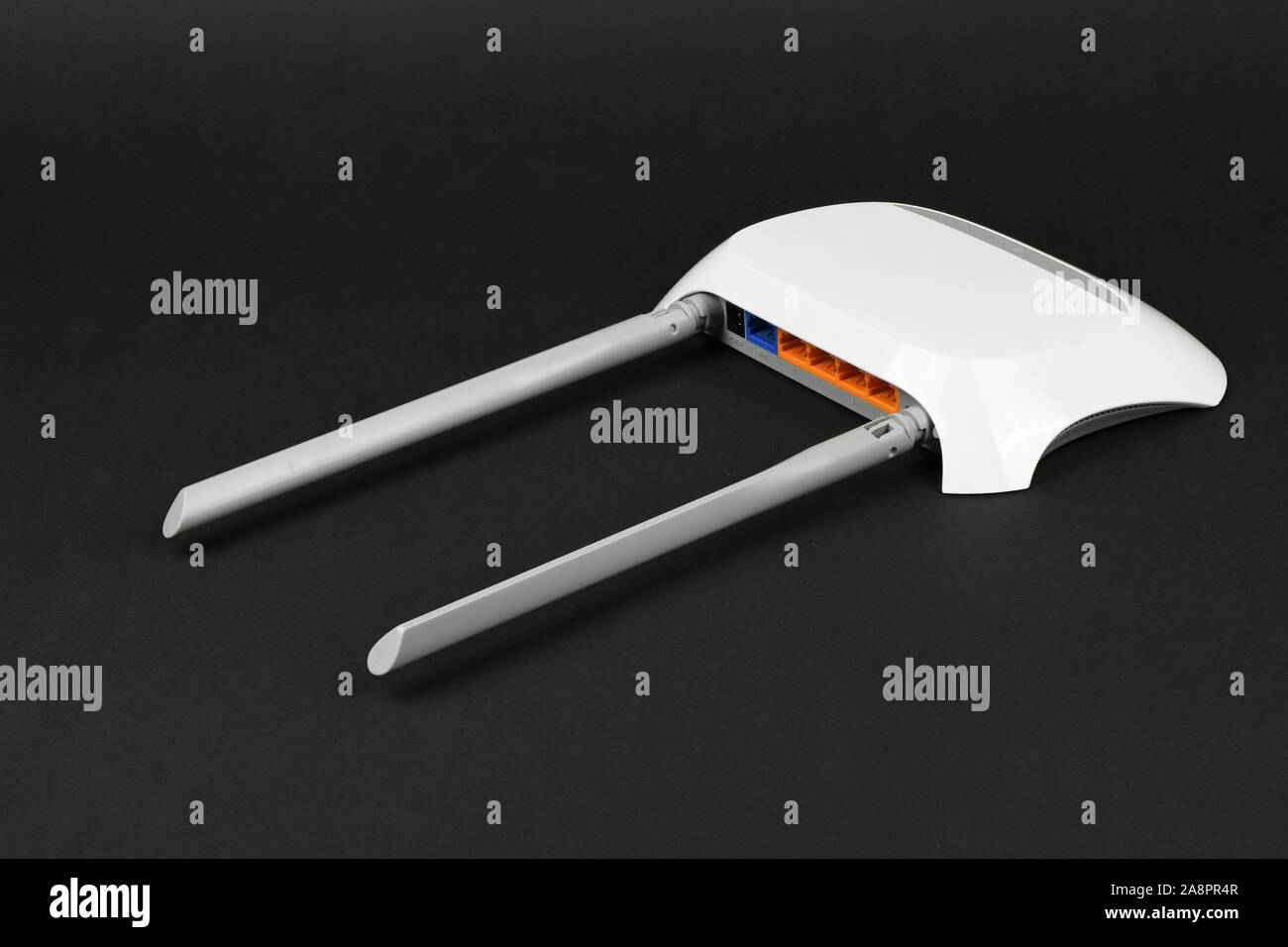 White WI-FI router with two antennas isolated on black background ...