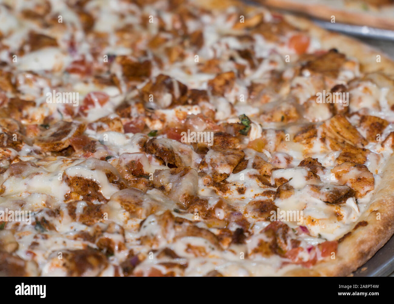Close up stock photo of typical generic chicken pizza pie with cheese ...