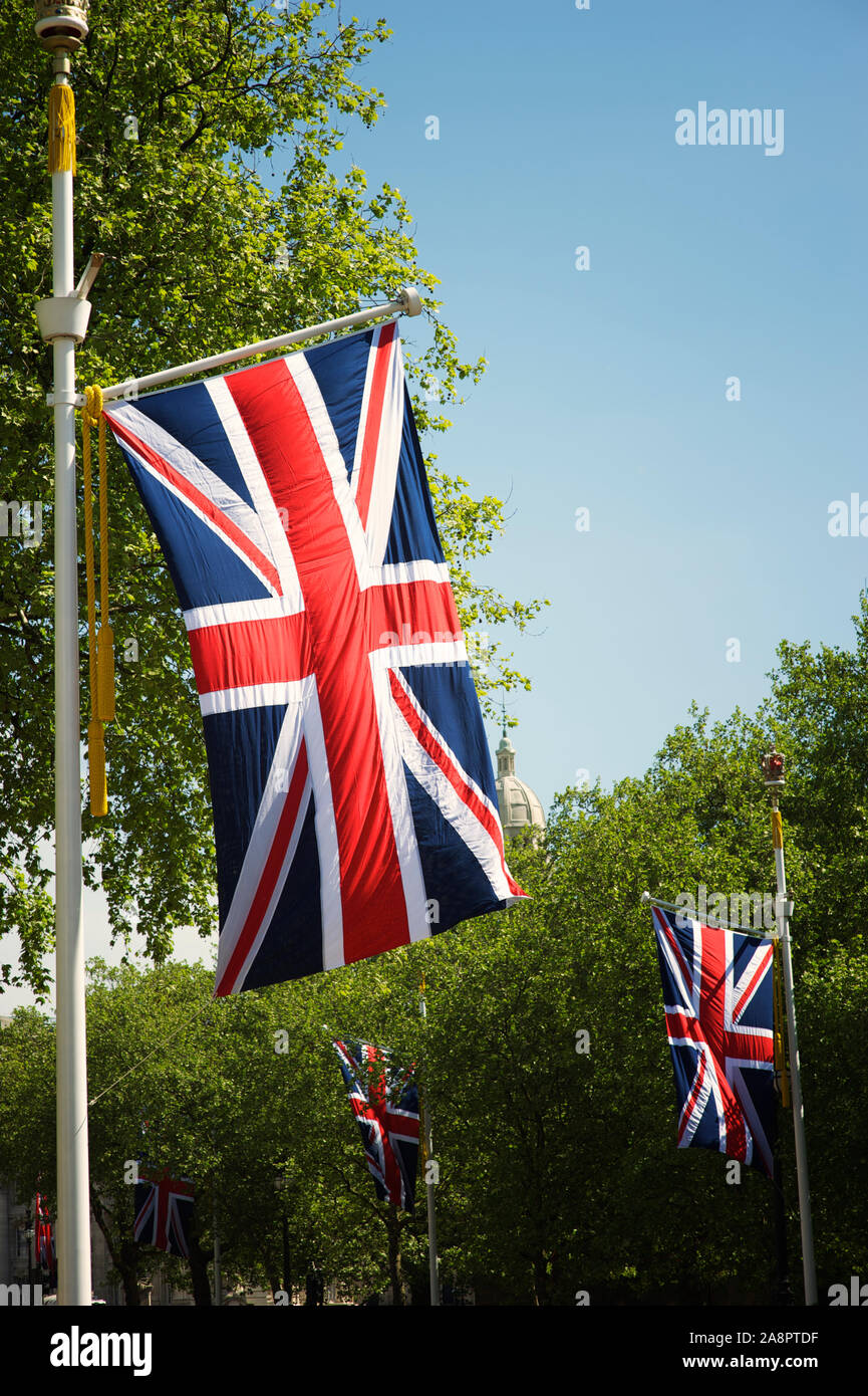 Flags hanging above the streets hi-res stock photography and images - Alamy