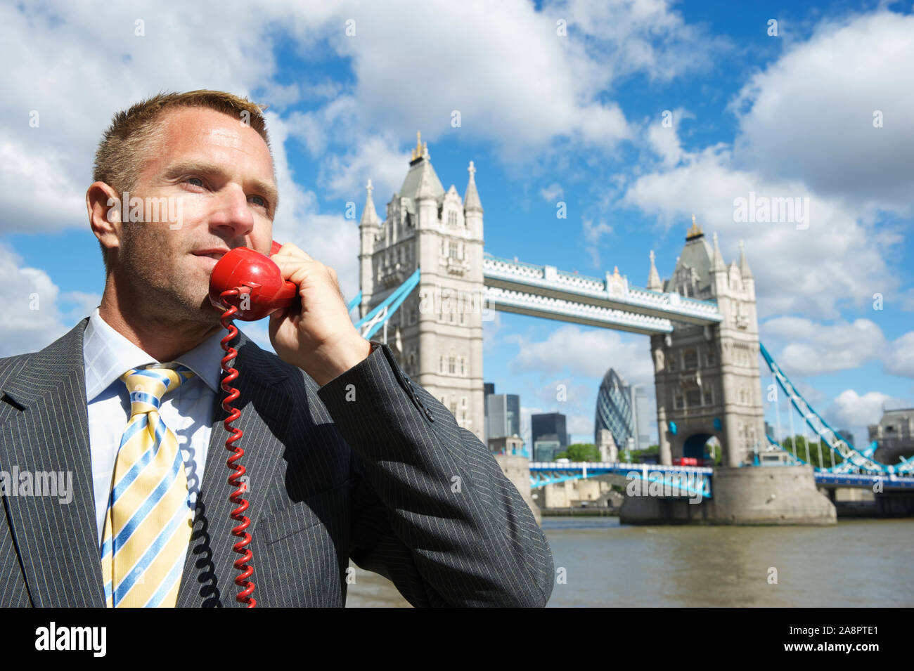 British businessman answering an urgent call to the hotline on a old ...